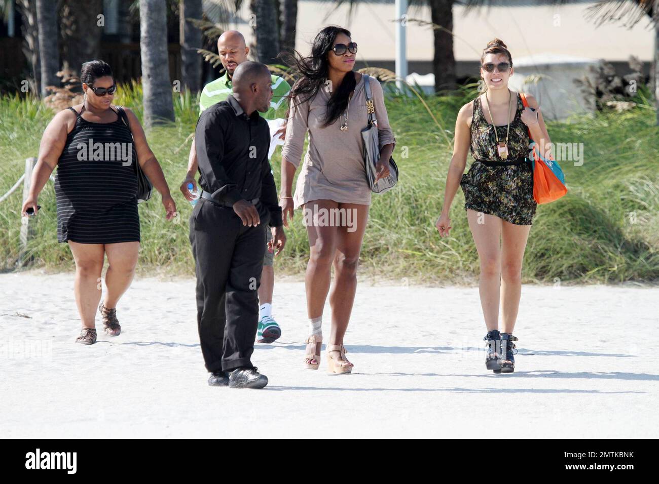 Tennis champ Serena Williams wearing a bikini and long hair extensions ...
