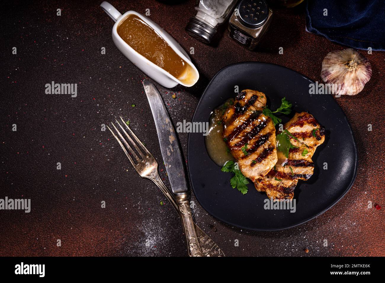 American bbq food concept. Grilled barbeque pork meat steaks with ...
