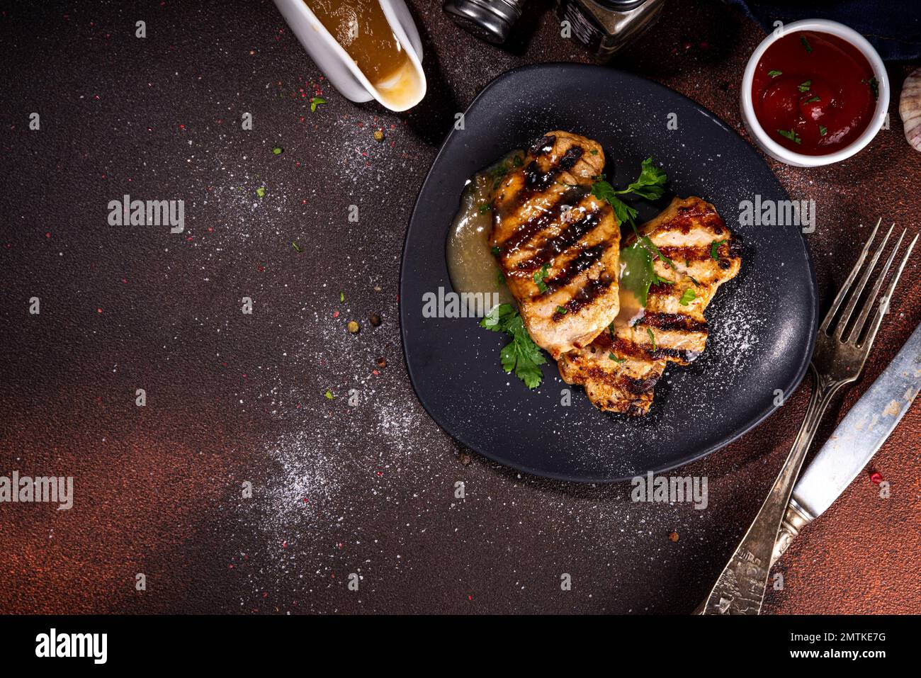 American bbq food concept. Grilled barbeque pork meat steaks with ...