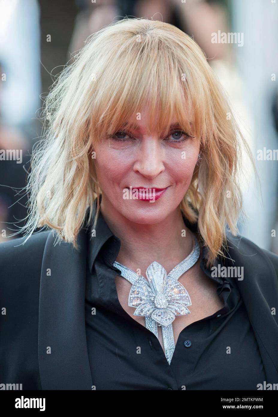 Uma Thurman poses for photographers upon arrival at the screening of ...