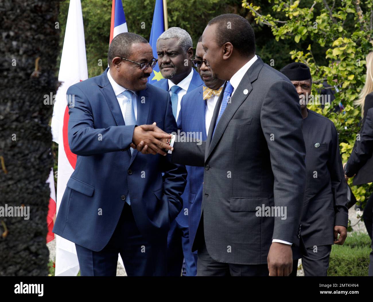 Ethiopia's Prime Minister Haile Mariam Desalegn, left, shakes hands ...