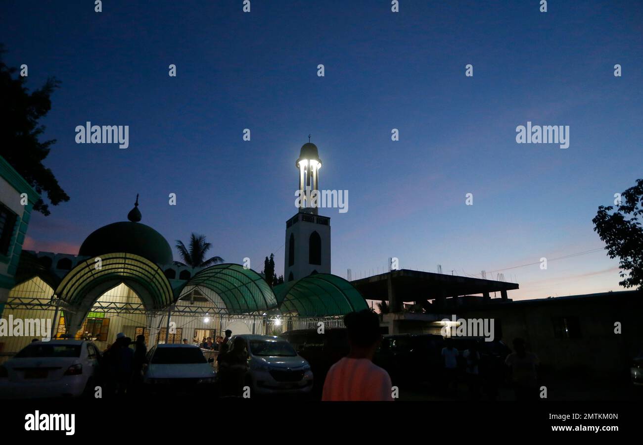 Filipino Muslims leave a mosque after praying on the first day of the ...