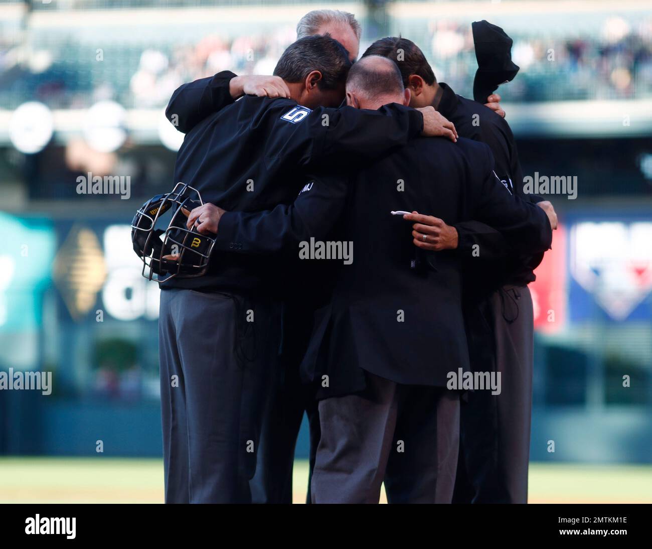 Clockwise from left, third base umpire Angel Hernandez, second base ...