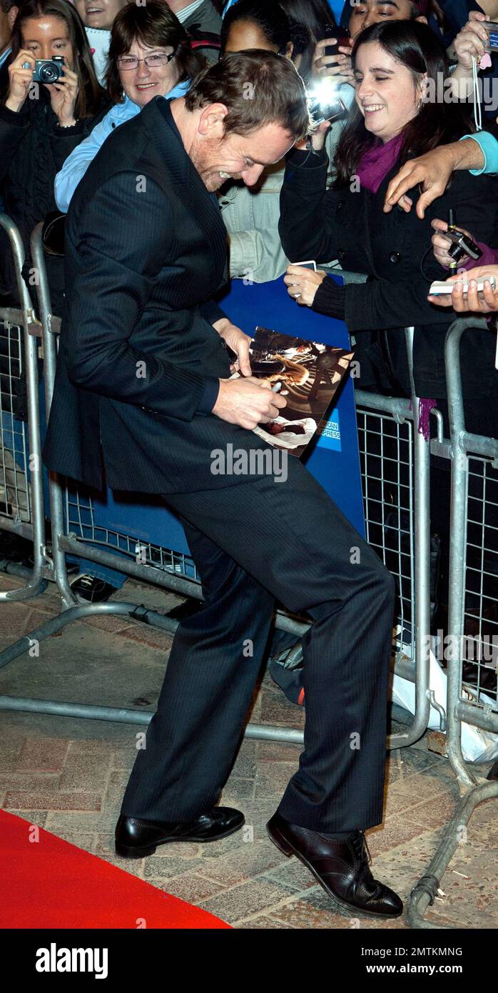 Michael Fassbender signs autographs at the premiere of "Shame" at the ...