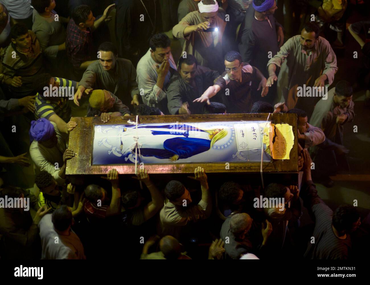 Relatives of Coptic Christian Ayied Ward, who was a victim of an attack ...