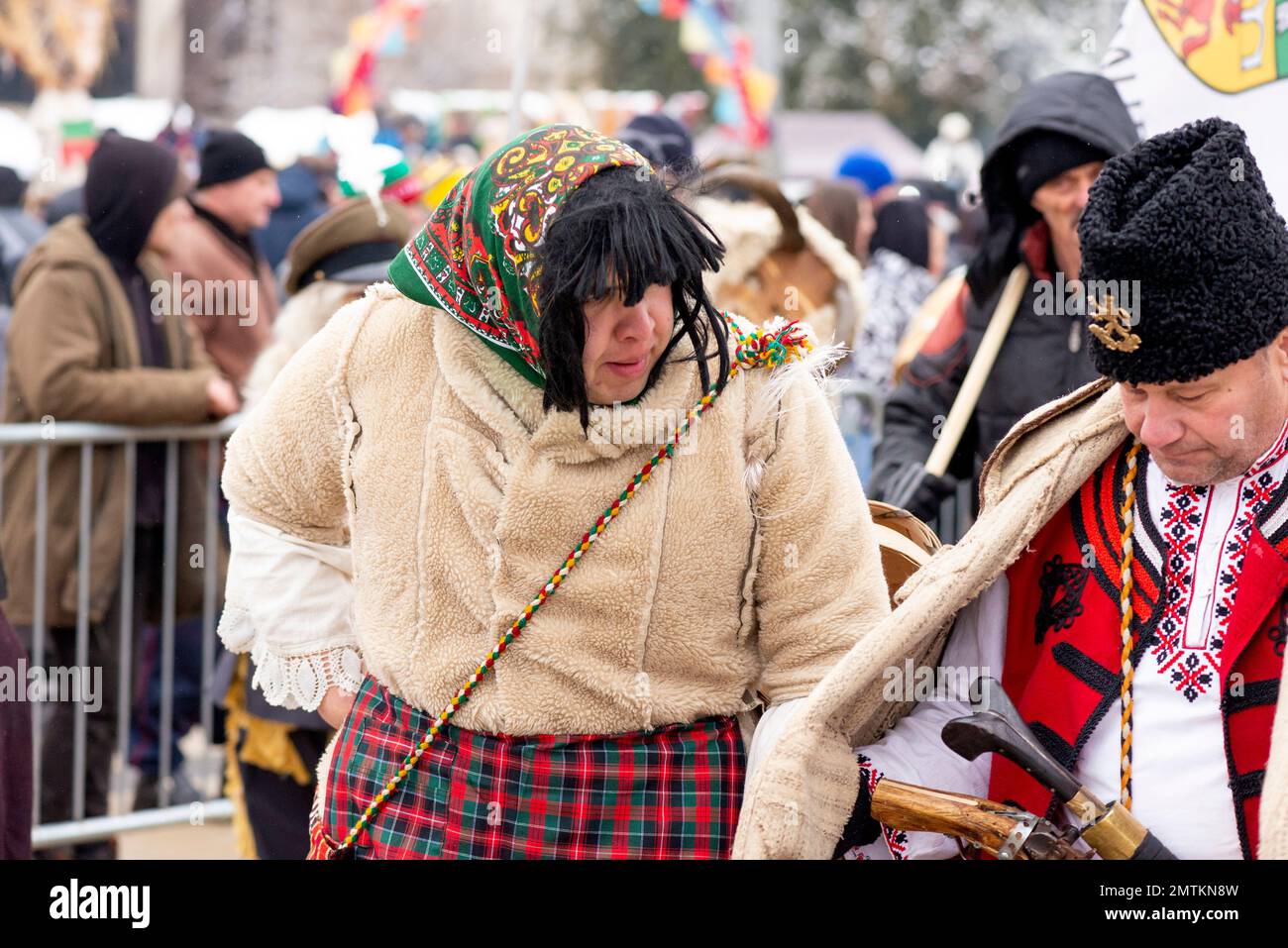 Kukeri dancers with their masks off after performing at the Surva ...