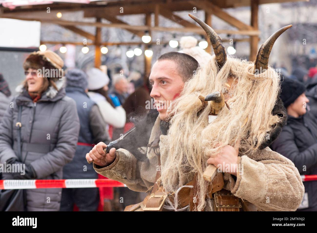 Male Kukeri dancer with mask off after performing at the Surva ...