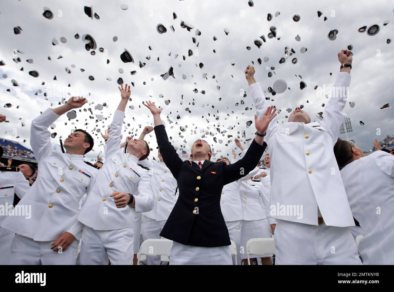 U.S. Naval Academy graduates celebrate at the end of the Academy's ...
