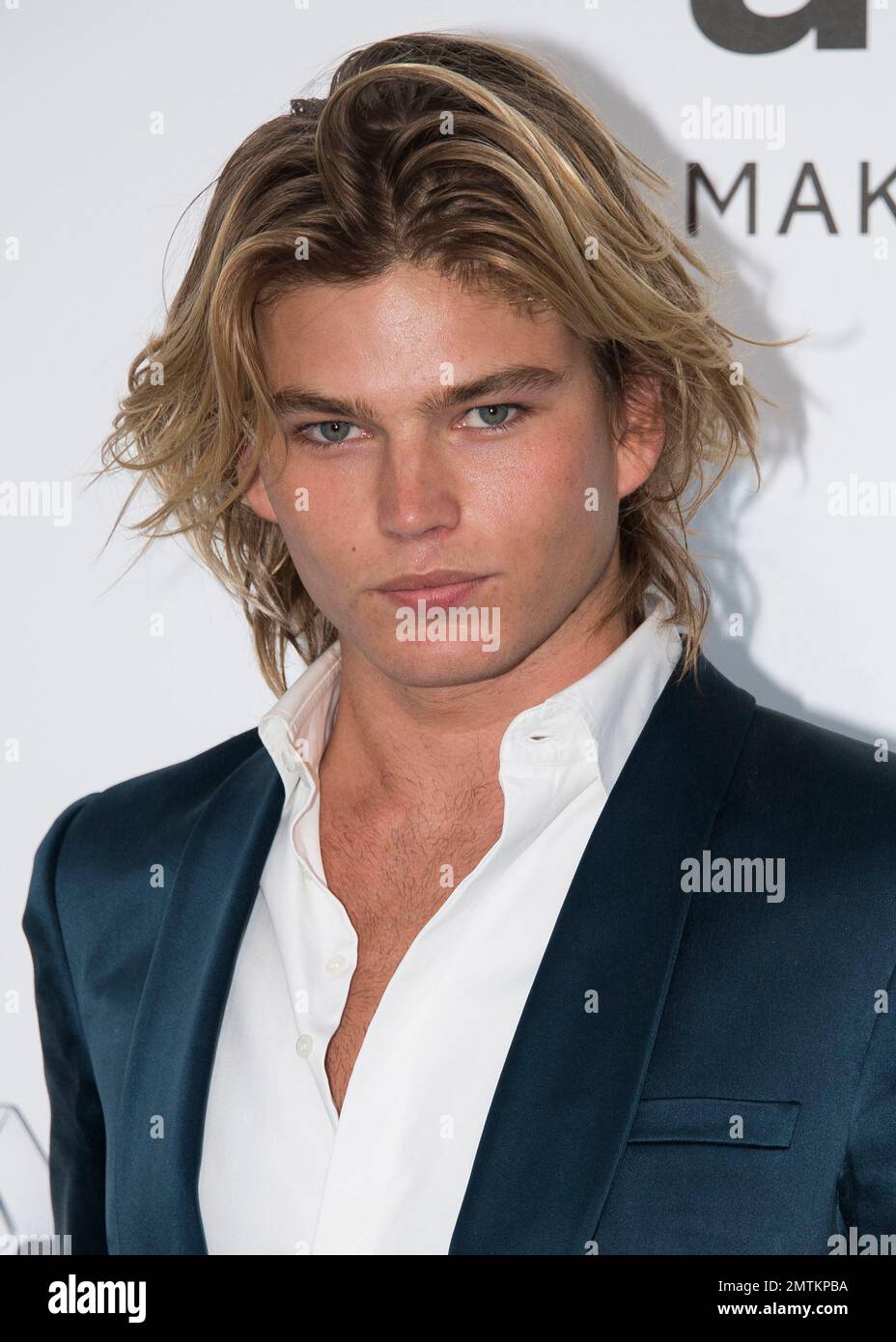 Jordan Barrett poses for photographers upon arrival at the amfAR ...