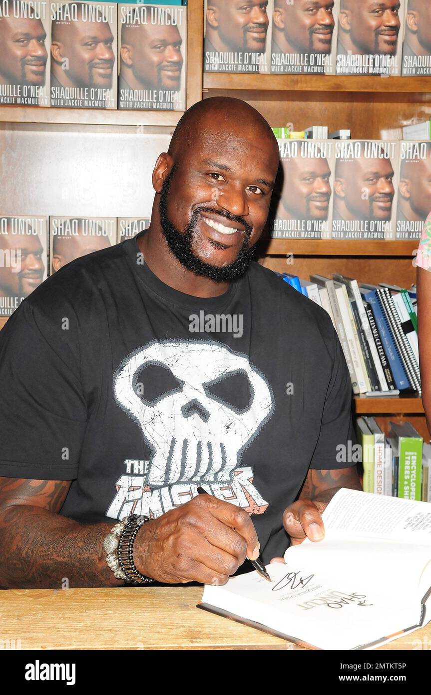 Shaquille O'Neal signs copies of his new book "Shaq Uncut" at Books and ...