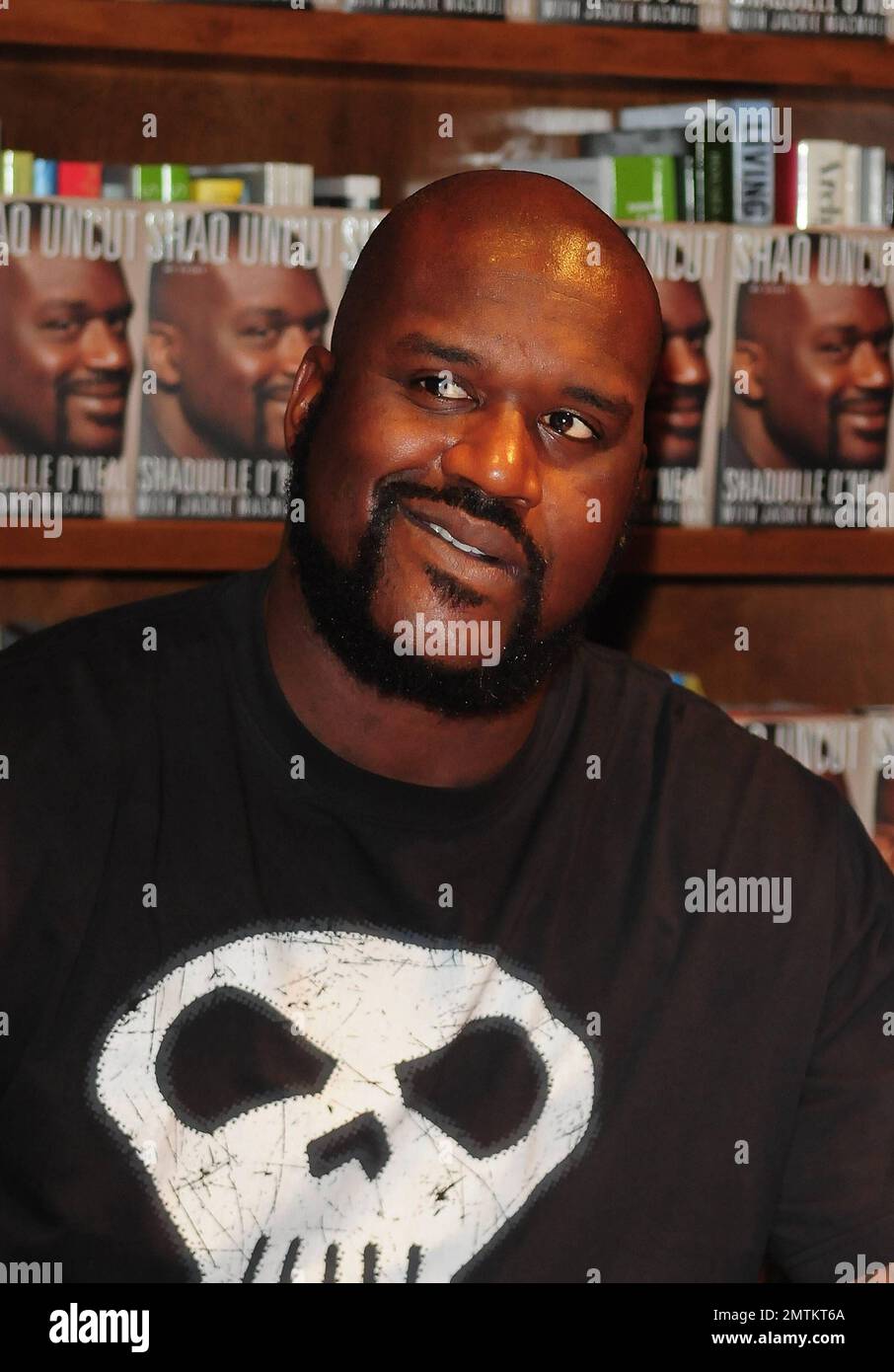 Shaquille O'Neal signs copies of his new book "Shaq Uncut" at Books and ...