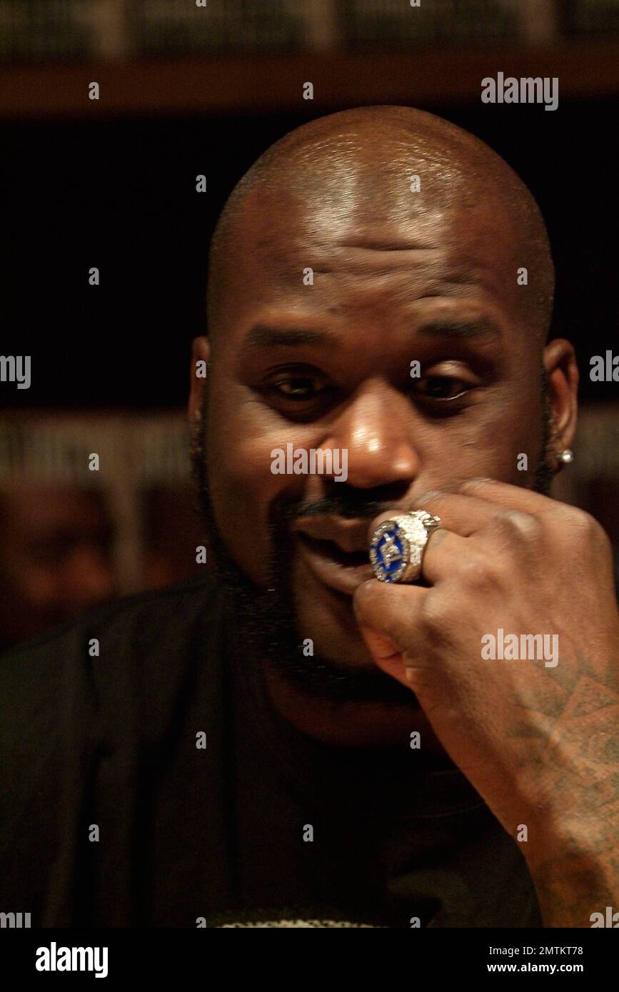 Shaquille O'Neal signs copies of his new book "Shaq Uncut" at Books and ...