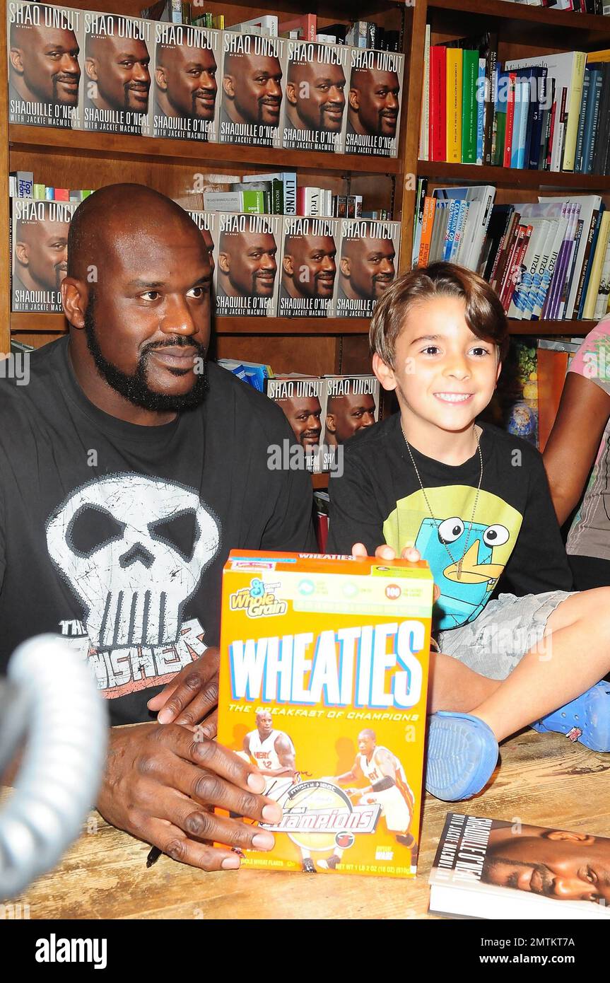 Shaquille O'Neal signs copies of his new book "Shaq Uncut" at Books and ...