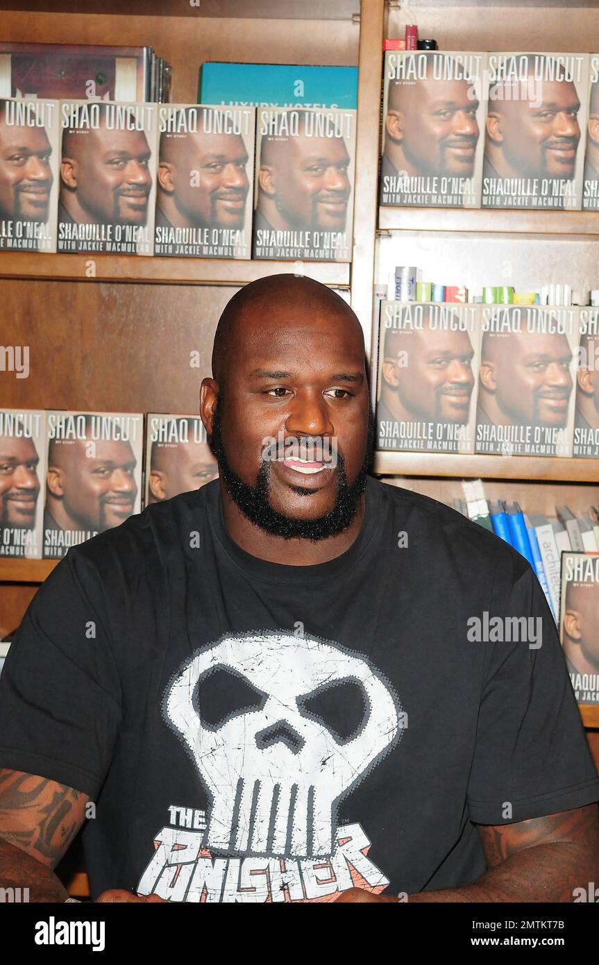 Shaquille O'Neal signs copies of his new book "Shaq Uncut" at Books and ...