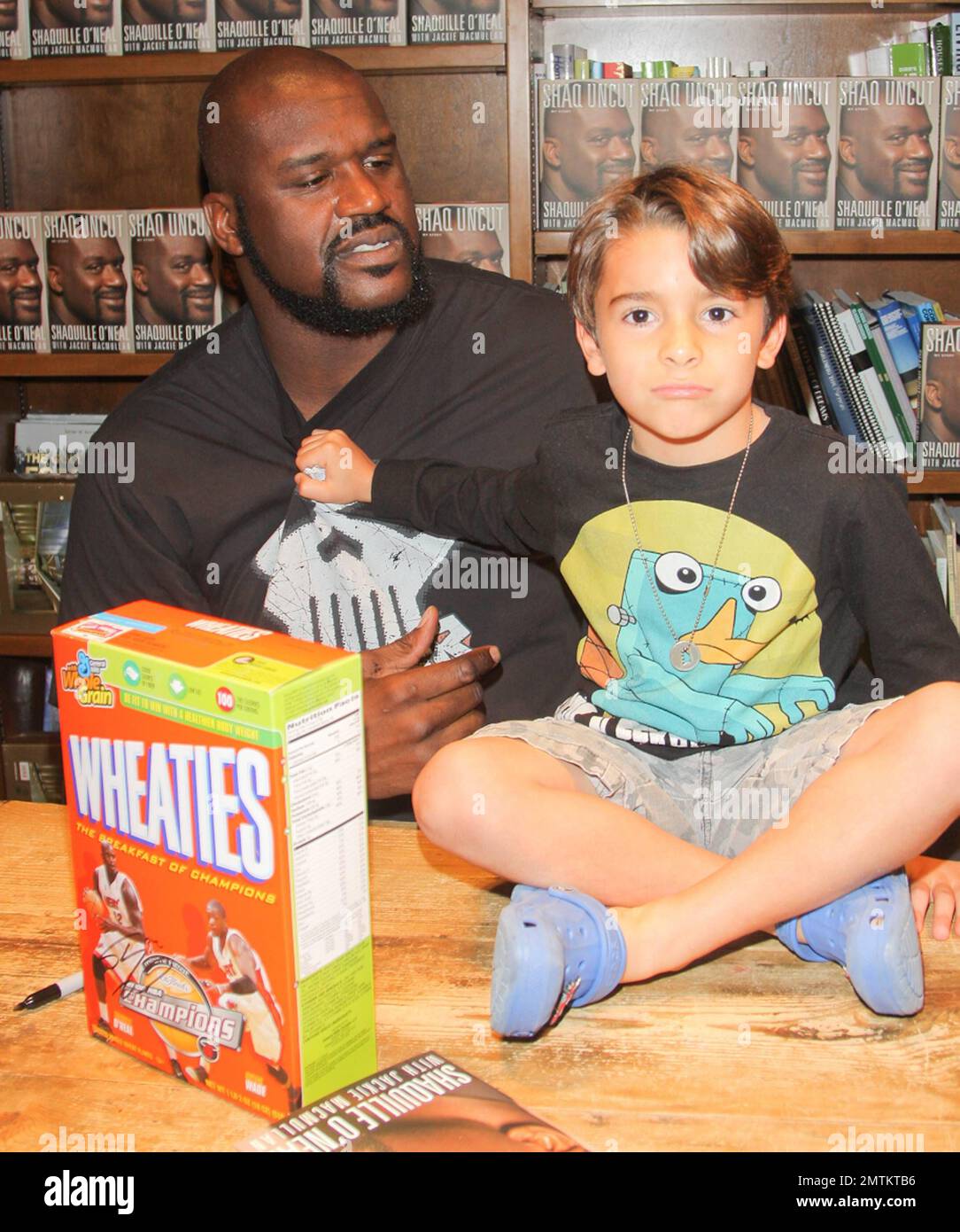Shaquille O'Neal signs copies of his new book "Shaq Uncut" at Books and ...