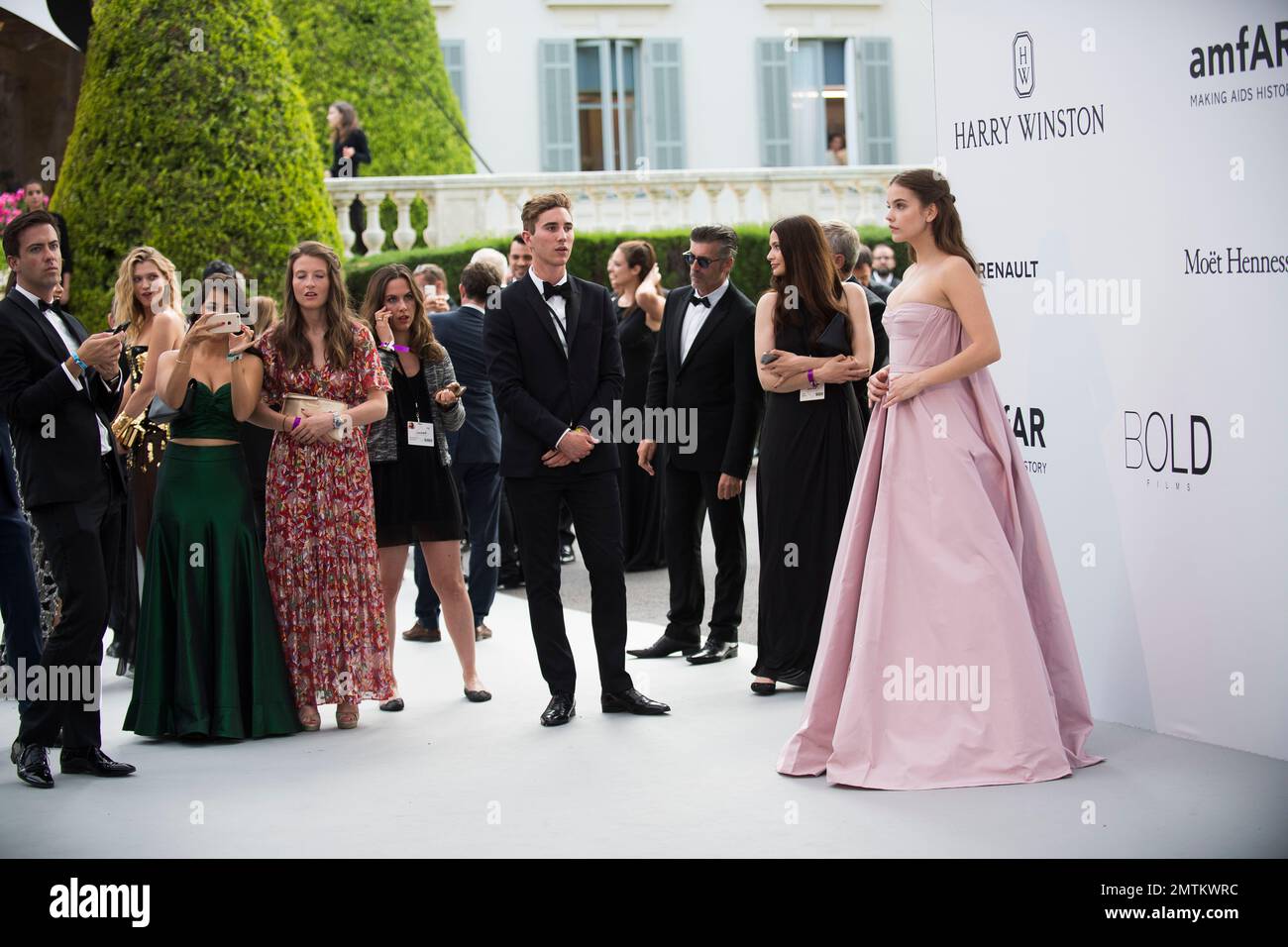 Barbara Palvin poses for photographers upon arrival at the amfAR ...
