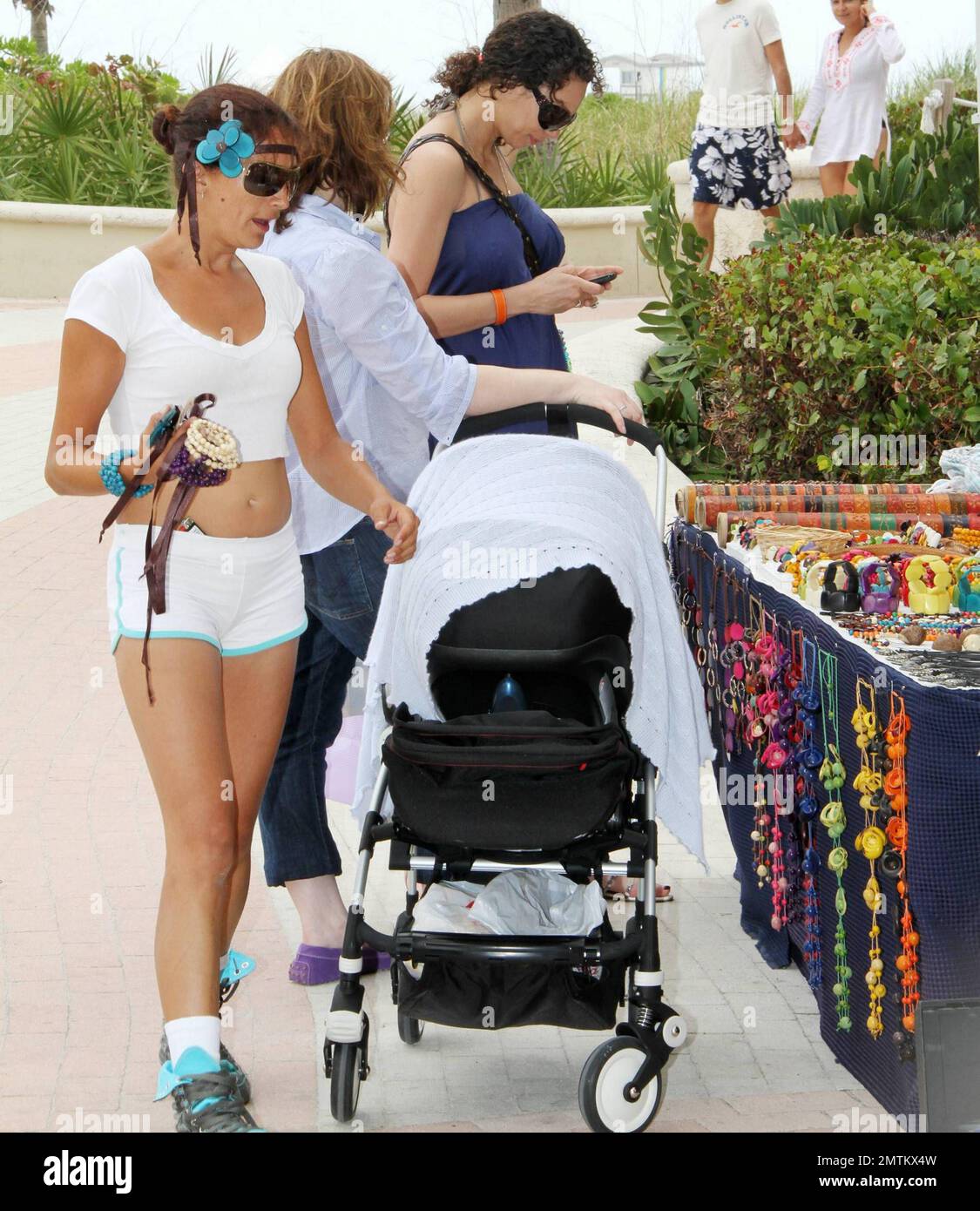 Sharlely Becker goes for a walk with nanny and Baby Amadeus. She first ...