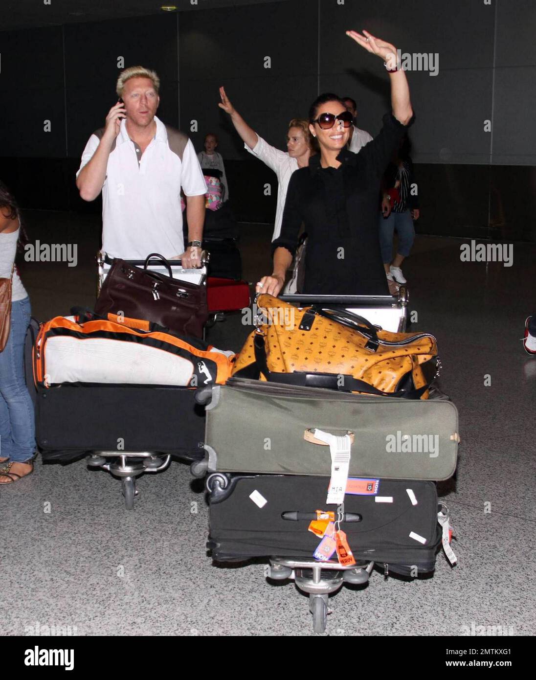 EXCLUSIVE!! Boris Becker and his pregnant wife Sharlely are greeted by ...