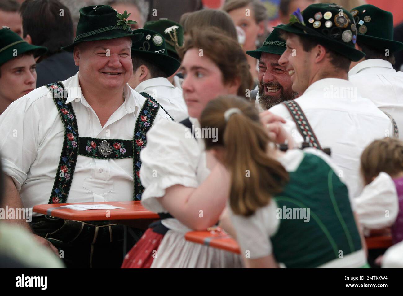 People dressed in traditional clothes attend the 40th Alpine Country ...