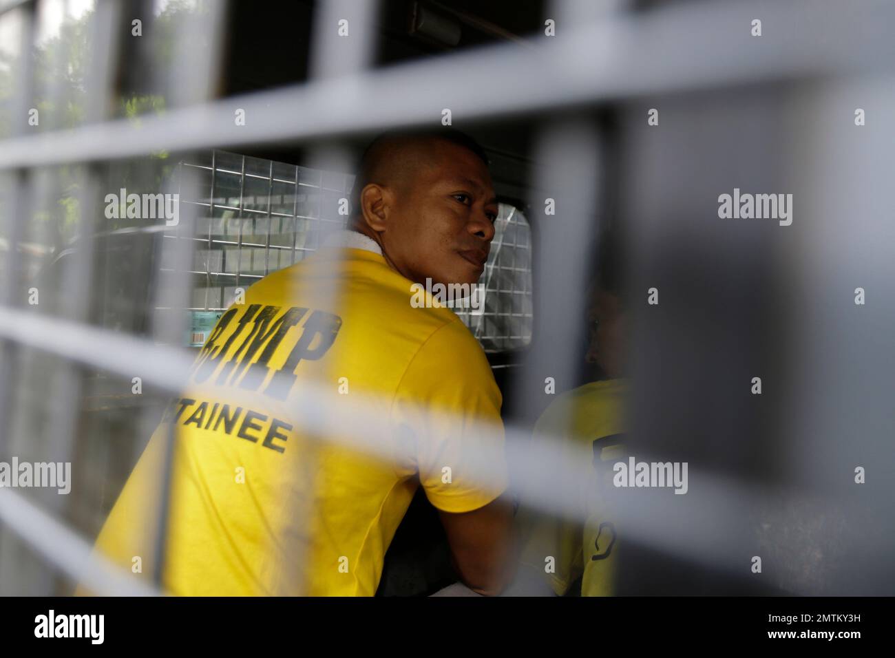 Jerri Arraz looks out from a jail vehicle after his trial at the Quezon ...