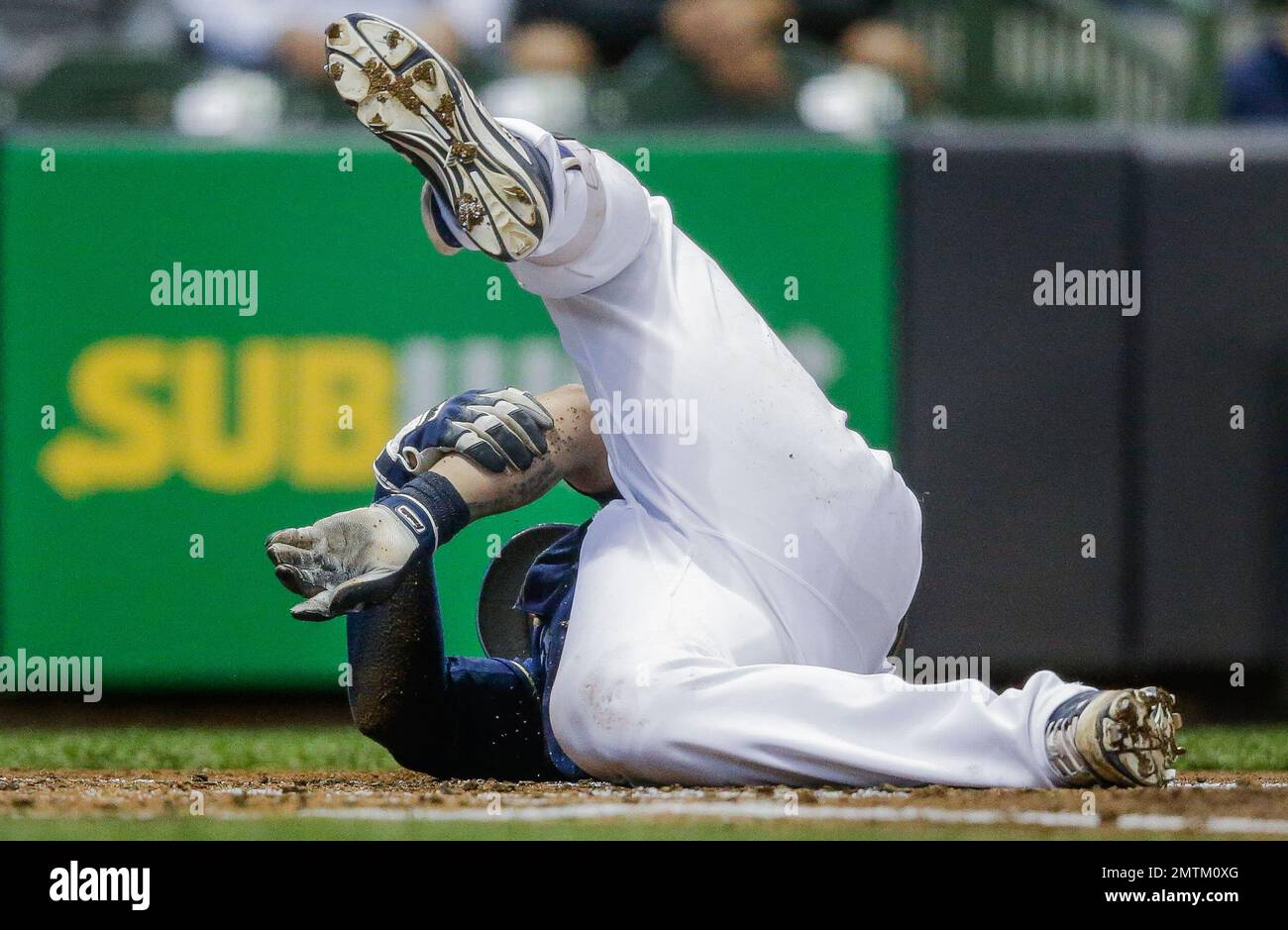 Milwaukee Brewers' Manny Pina is hit in the arm from a pitch by Arizona ...