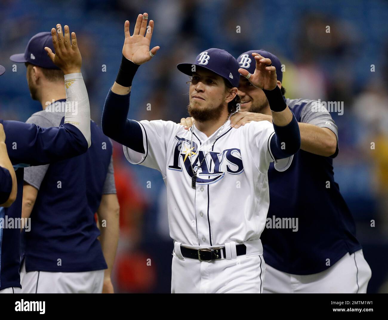 Tampa Bay Rays' Colby Rasmus celebrates with teammates after the team ...