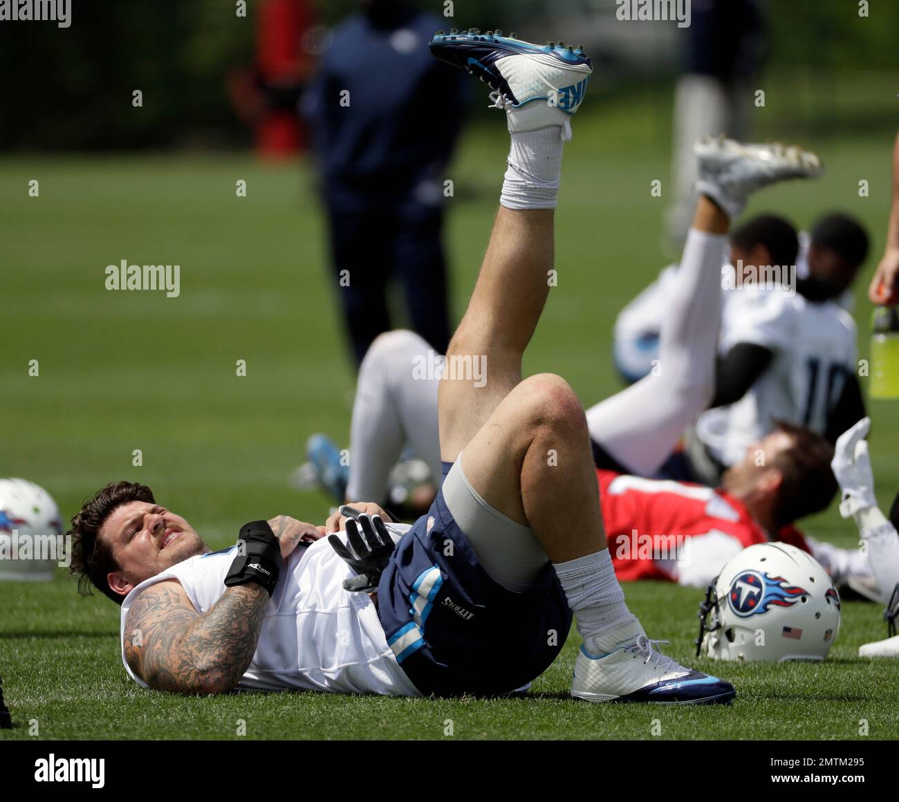 Tennessee Titans tackle Taylor Lewan (77) stretches during the team's ...