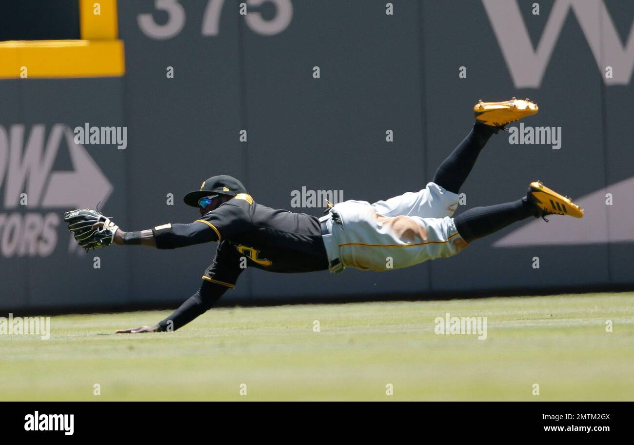 Pittsburgh Pirates left fielder Josh Harrison (5) makes a diving catch ...