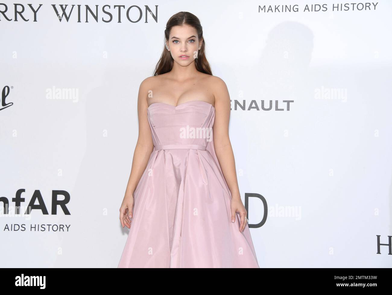 Model Barbara Palvin poses for photographers upon arrival at the amfAR ...