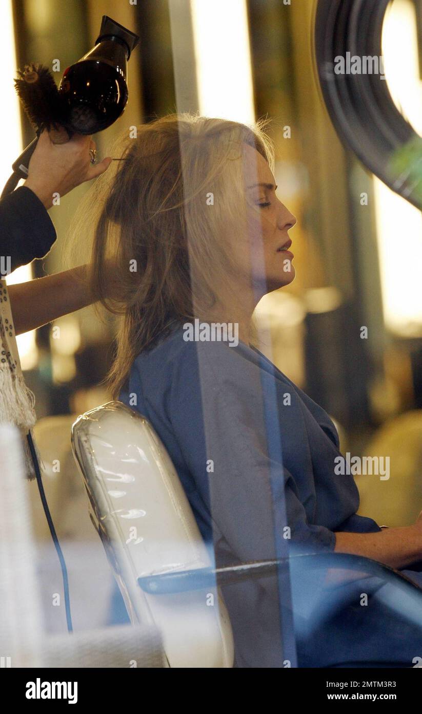 Sharon Stone shares a laugh with her stylist while getting her hair ...
