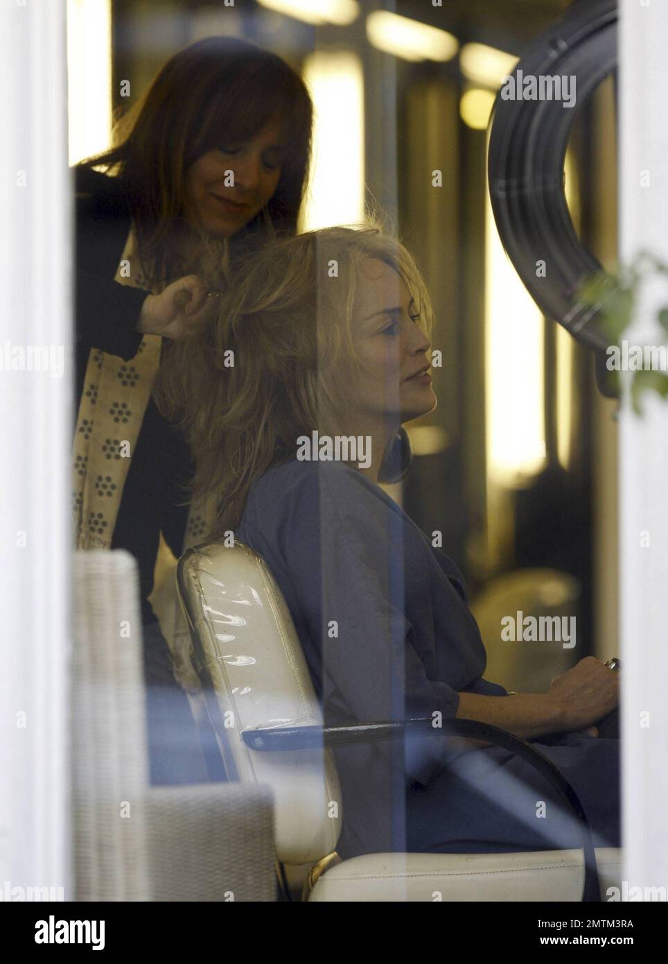 Sharon Stone shares a laugh with her stylist while getting her hair ...