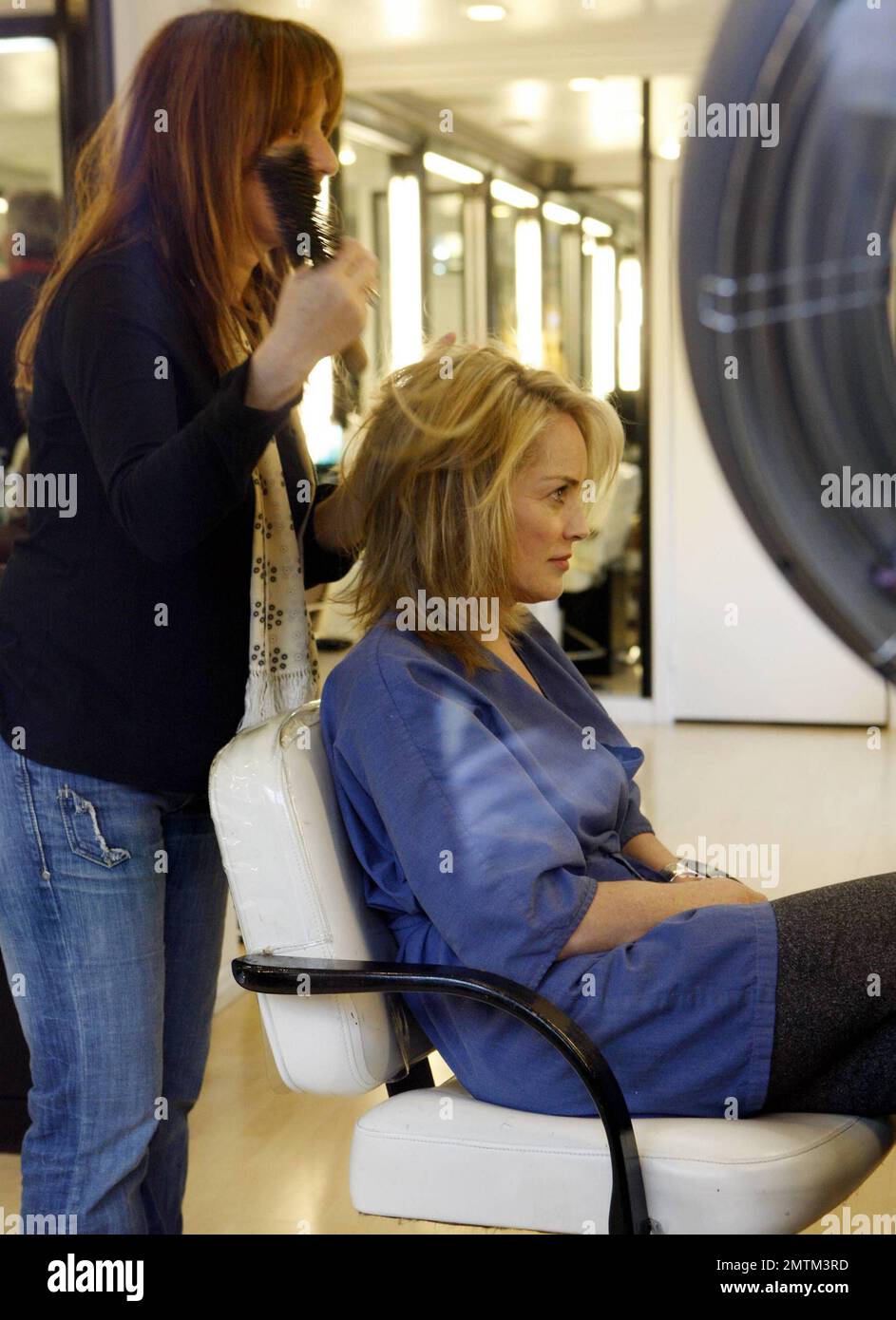 Sharon Stone shares a laugh with her stylist while getting her hair ...