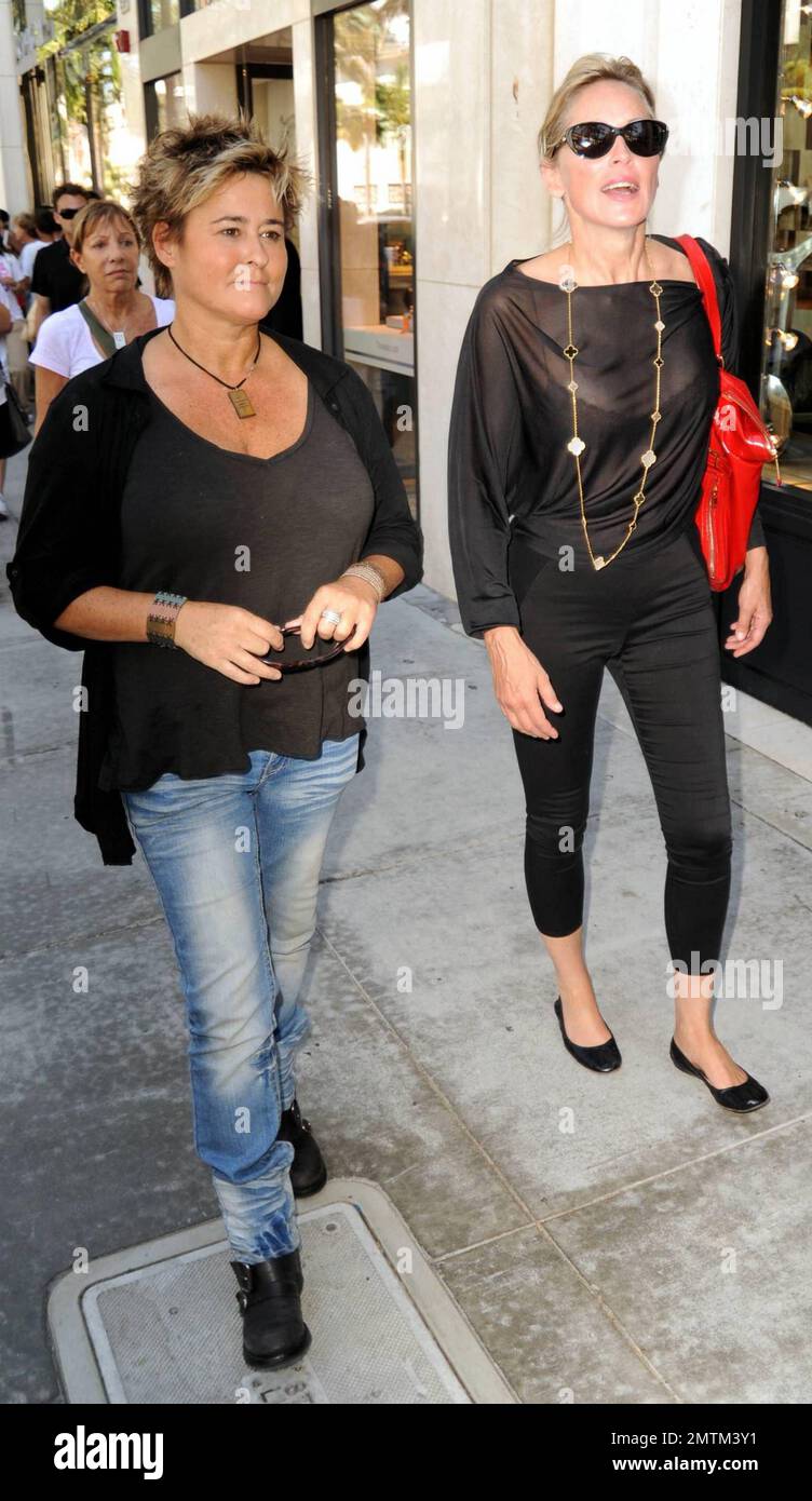 Sharon Stone smiles for photographers as she gets in a day of shopping ...