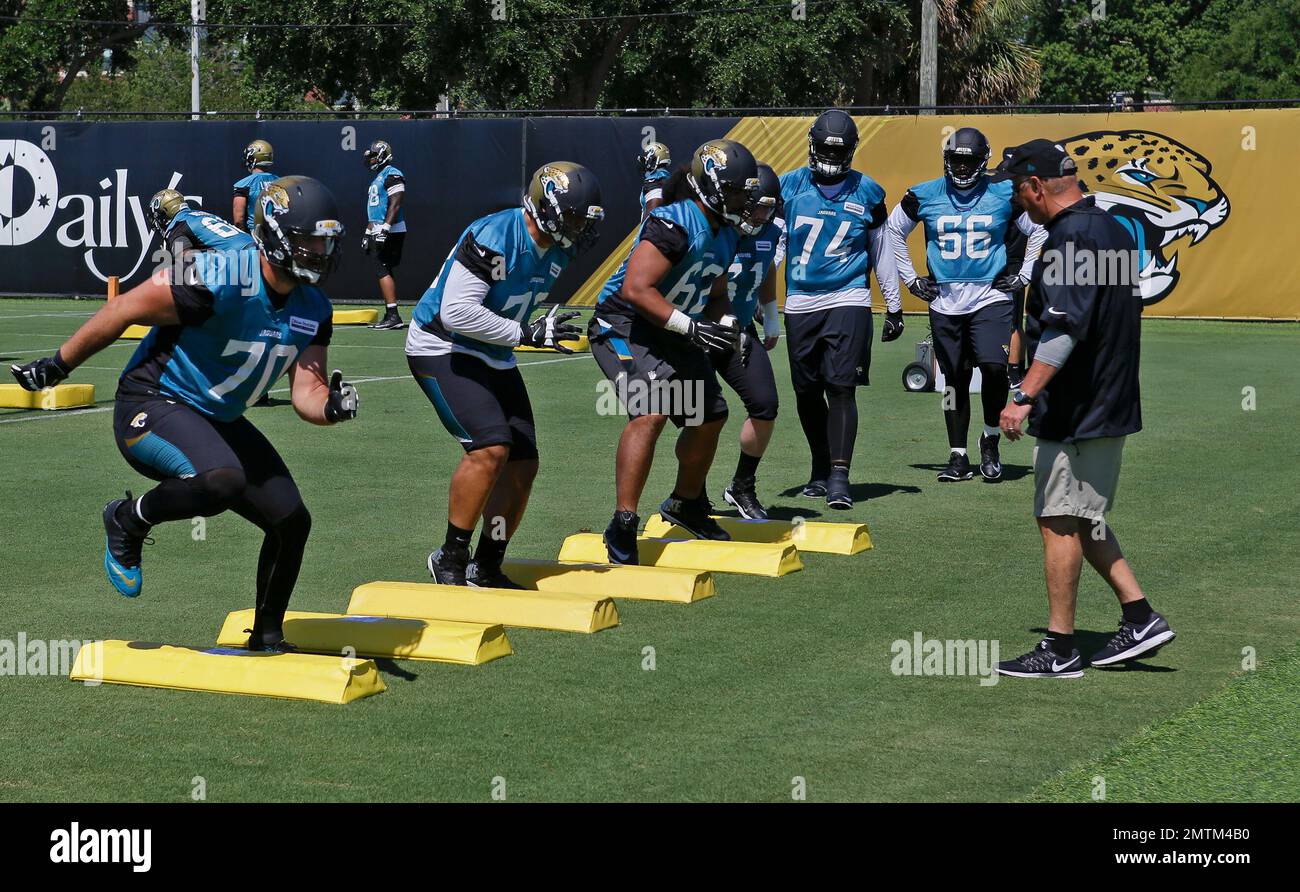 Jacksonville Jaguars players, from left, Luke Bowanko, Jeremiah Poutasi ...