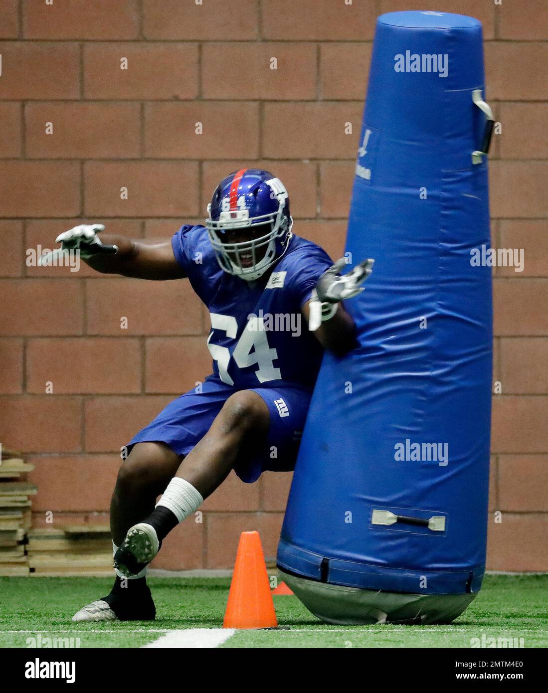 New York Giants defensive tackle Josh Banks runs a drill during the ...