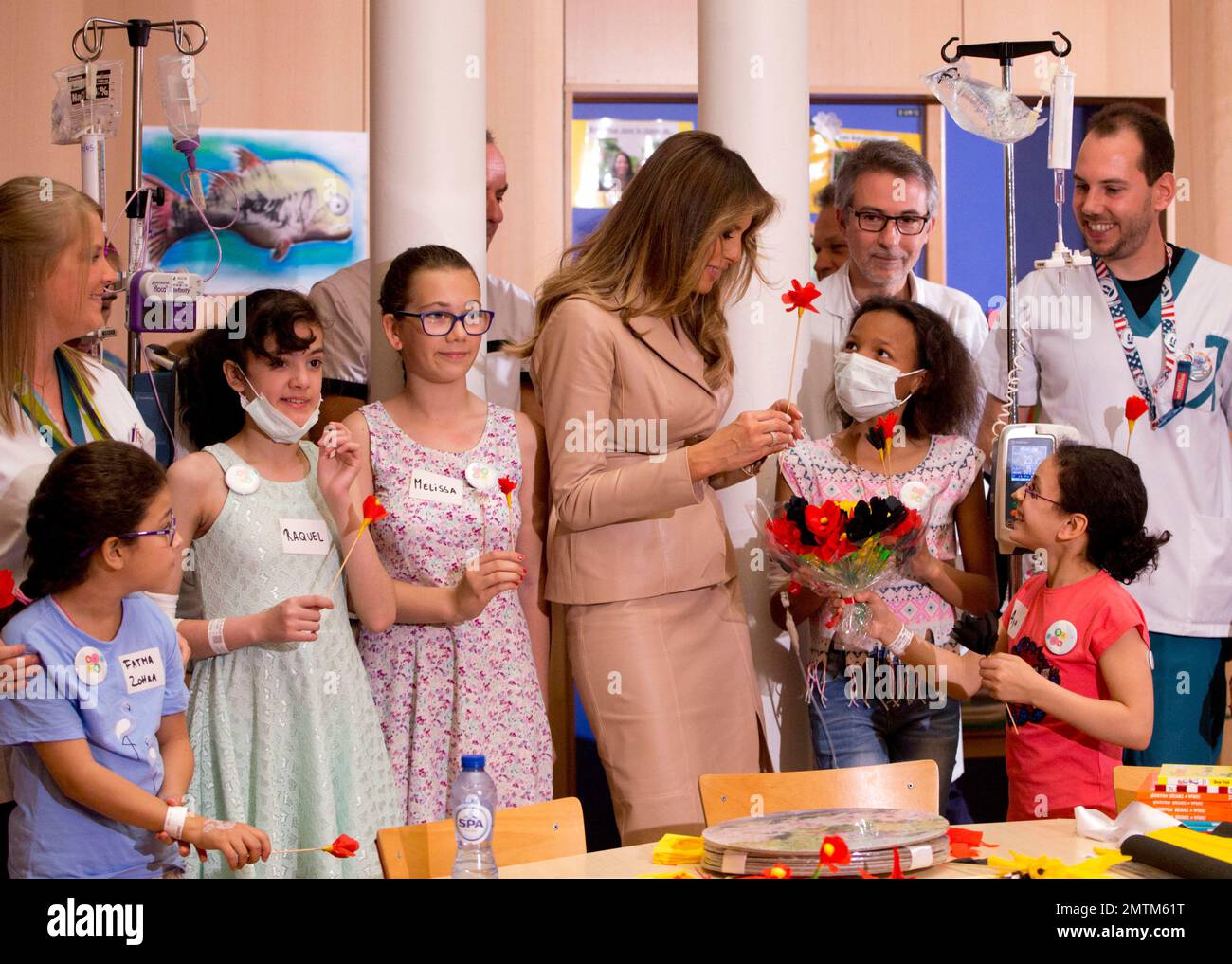 Melania Trump, the wife of US President Donald Trump, receives a crepe ...