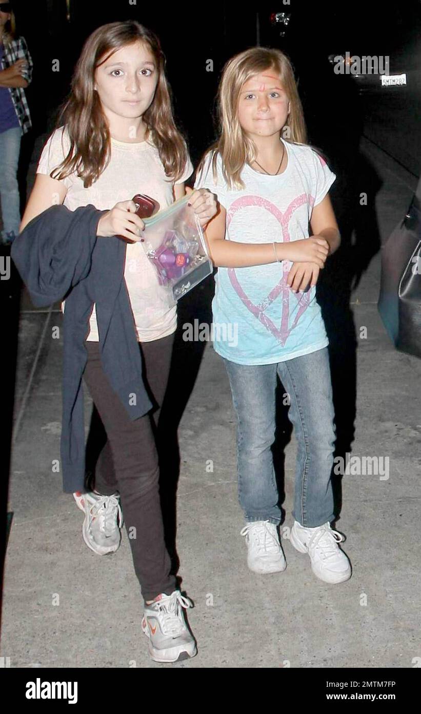 Shauna Sand is dressed down in a torn t shirt and jeans as she spends a ...