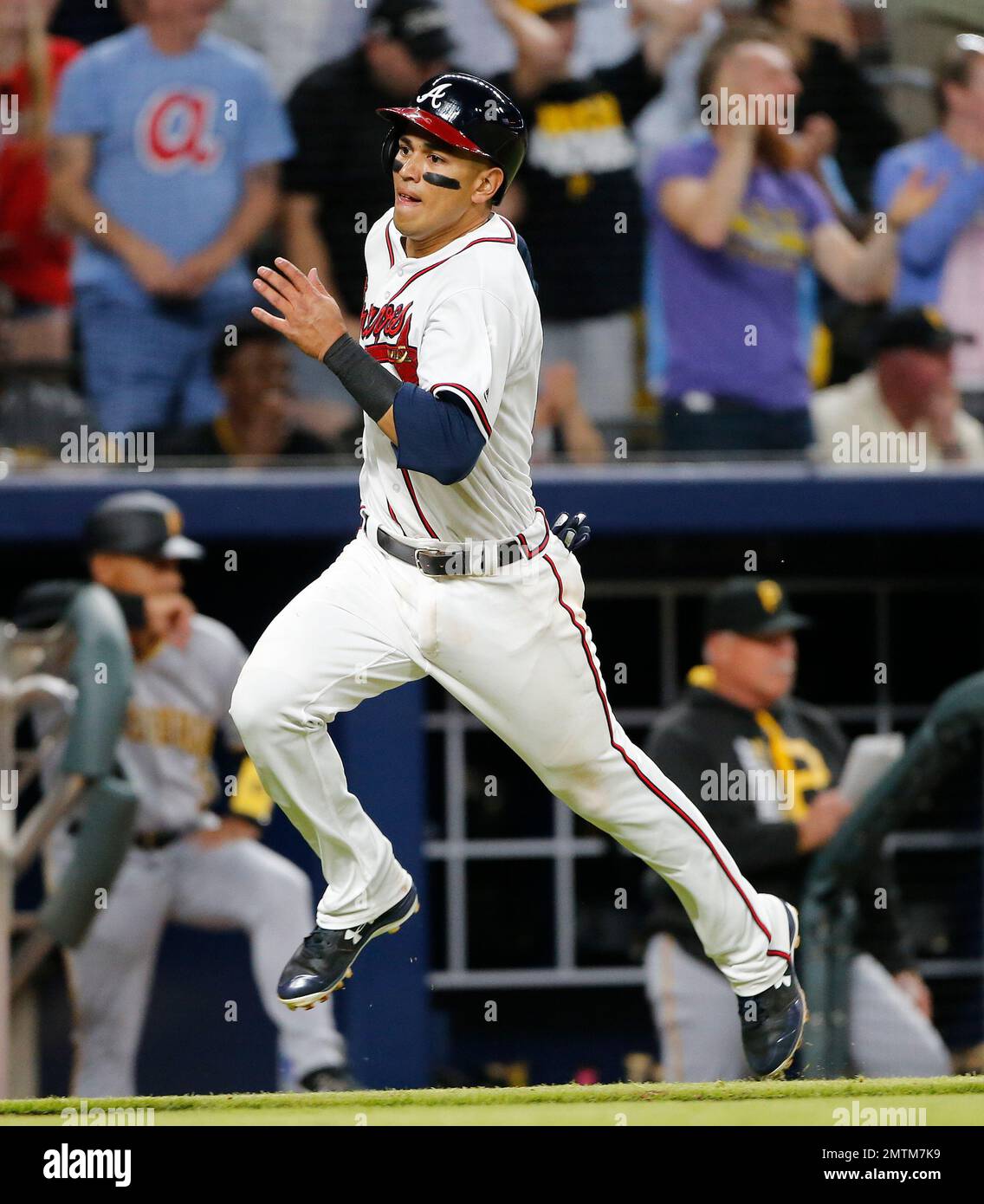 Atlanta Braves third baseman Rio Ruiz (14) scores against the ...