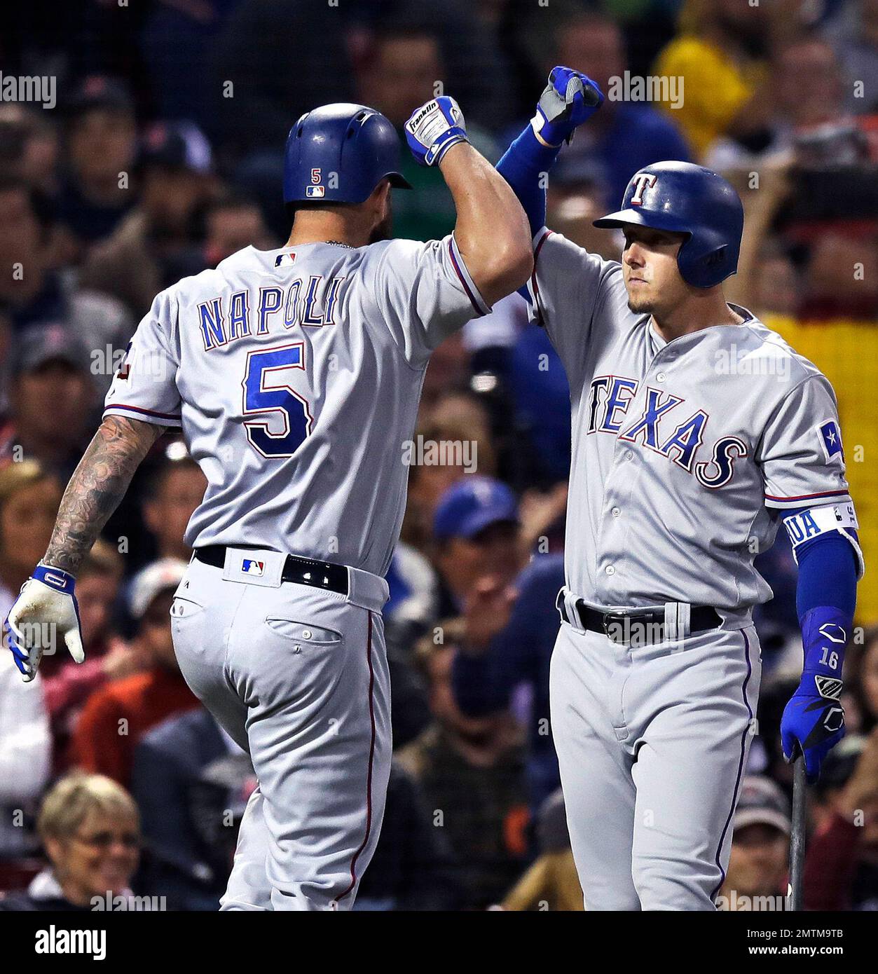 Texas Rangers first baseman Mike Napoli (5) is congratulated by Ryan ...