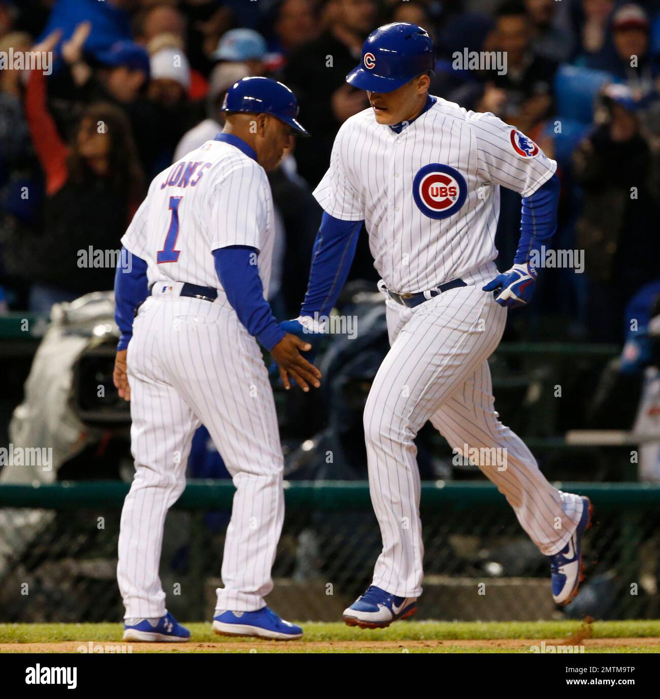Chicago Cubs' Anthony Rizzo, right, celebrates with third base coach ...