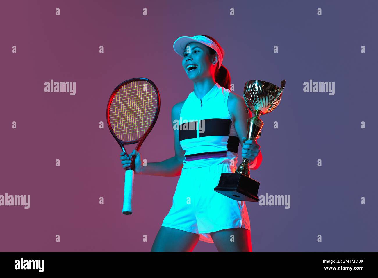 Winner. Excited young professional female tennis player in sports ...