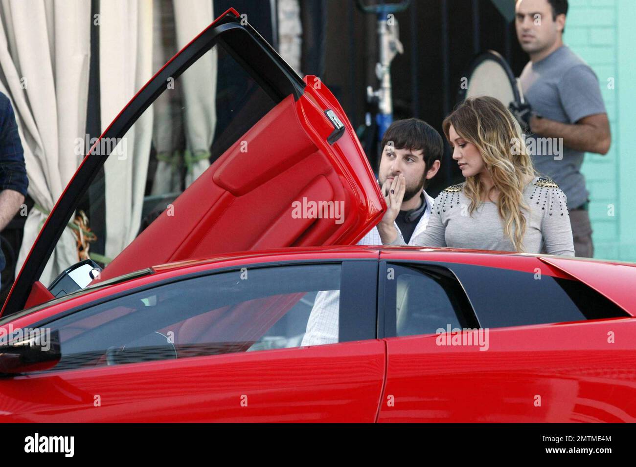 Hilary Duff films a scene in a red Lamborghini for her newest movie ...
