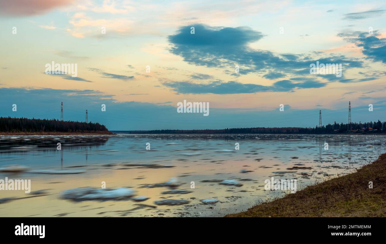 The remains of the last spring ice on a river in Yakutia float near the ...