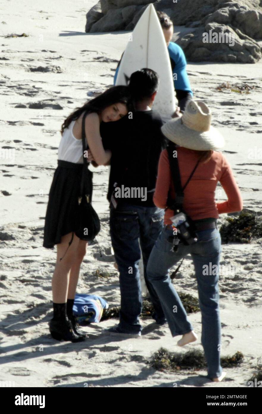 Shenae Grimes wears a white sleeveless top and black skirt paired with ...