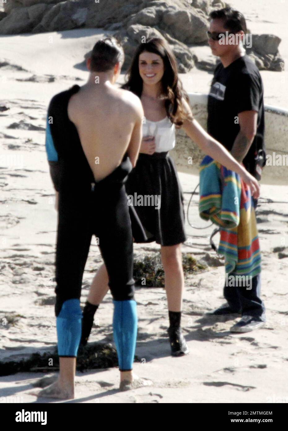 Shenae Grimes wears a white sleeveless top and black skirt paired with ...