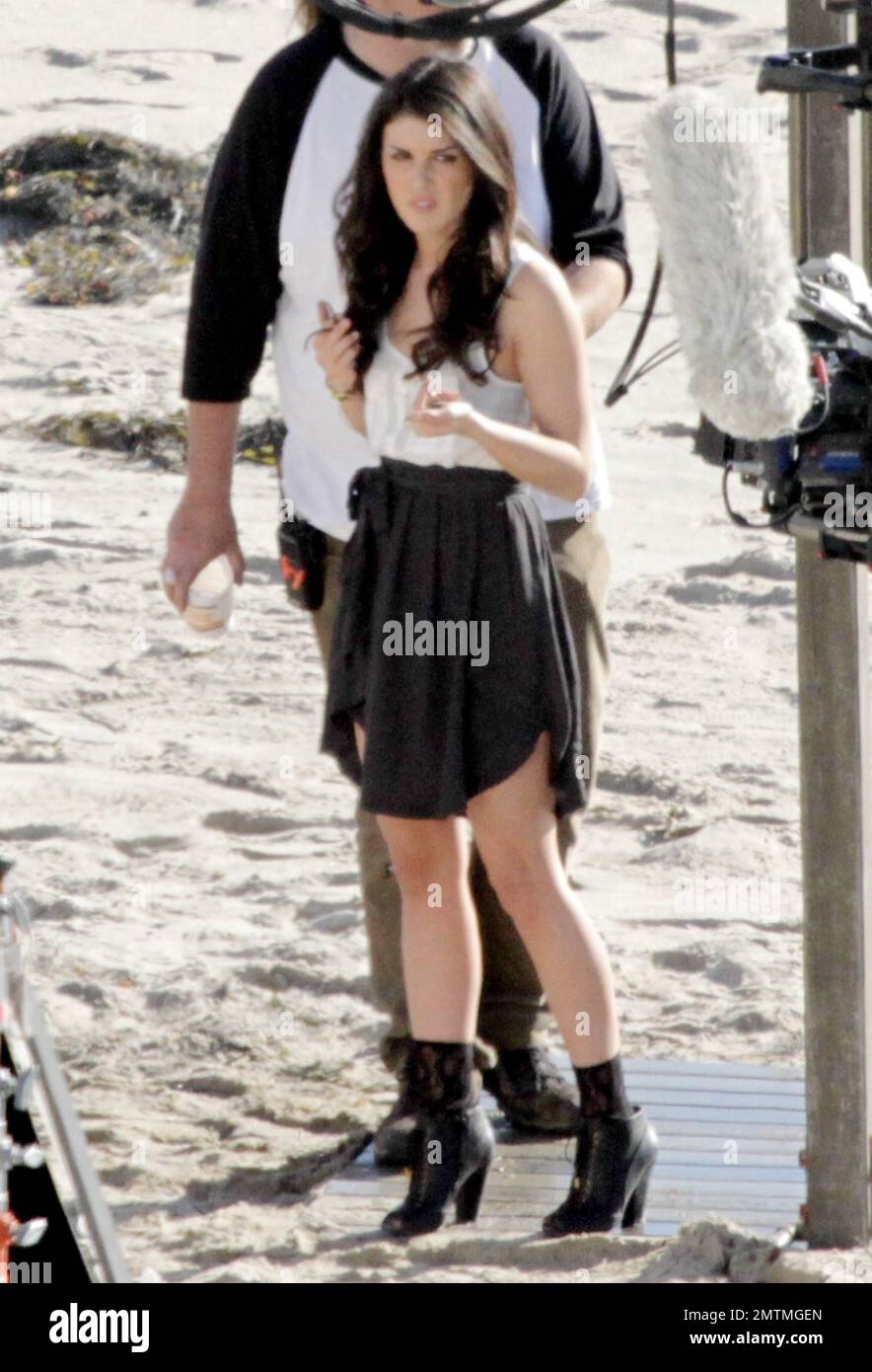 Shenae Grimes wears a white sleeveless top and black skirt paired with ...