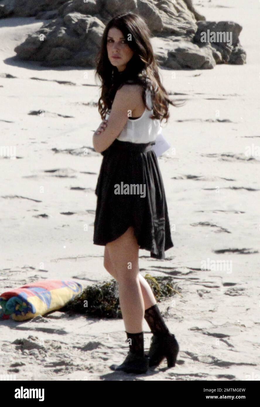 Shenae Grimes wears a white sleeveless top and black skirt paired with ...