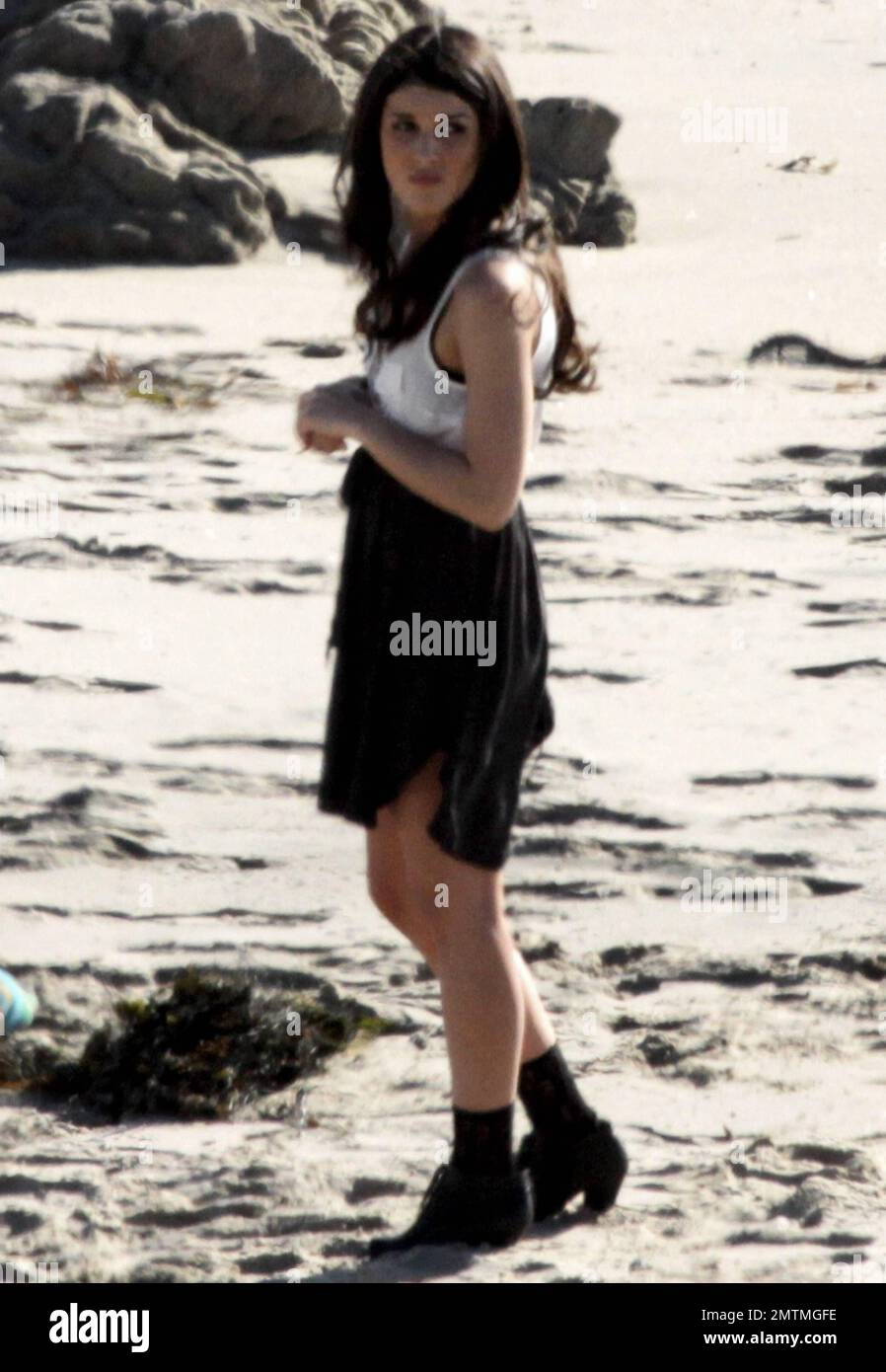 Shenae Grimes wears a white sleeveless top and black skirt paired with ...