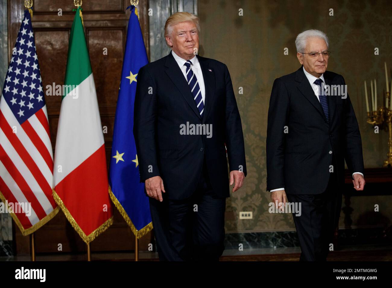 President Donald Trump walks with Italian President Sergio Mattarella ...