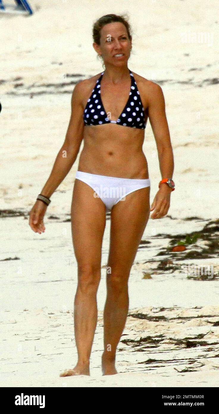Having been seen earlier in the day in a bright yellow bikini, rocker Sheryl Crow shows off her ...